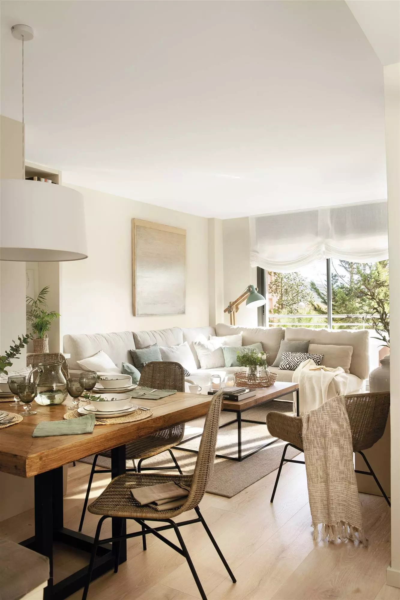 dining room open to the living room with wooden table and beige sofa 00521290