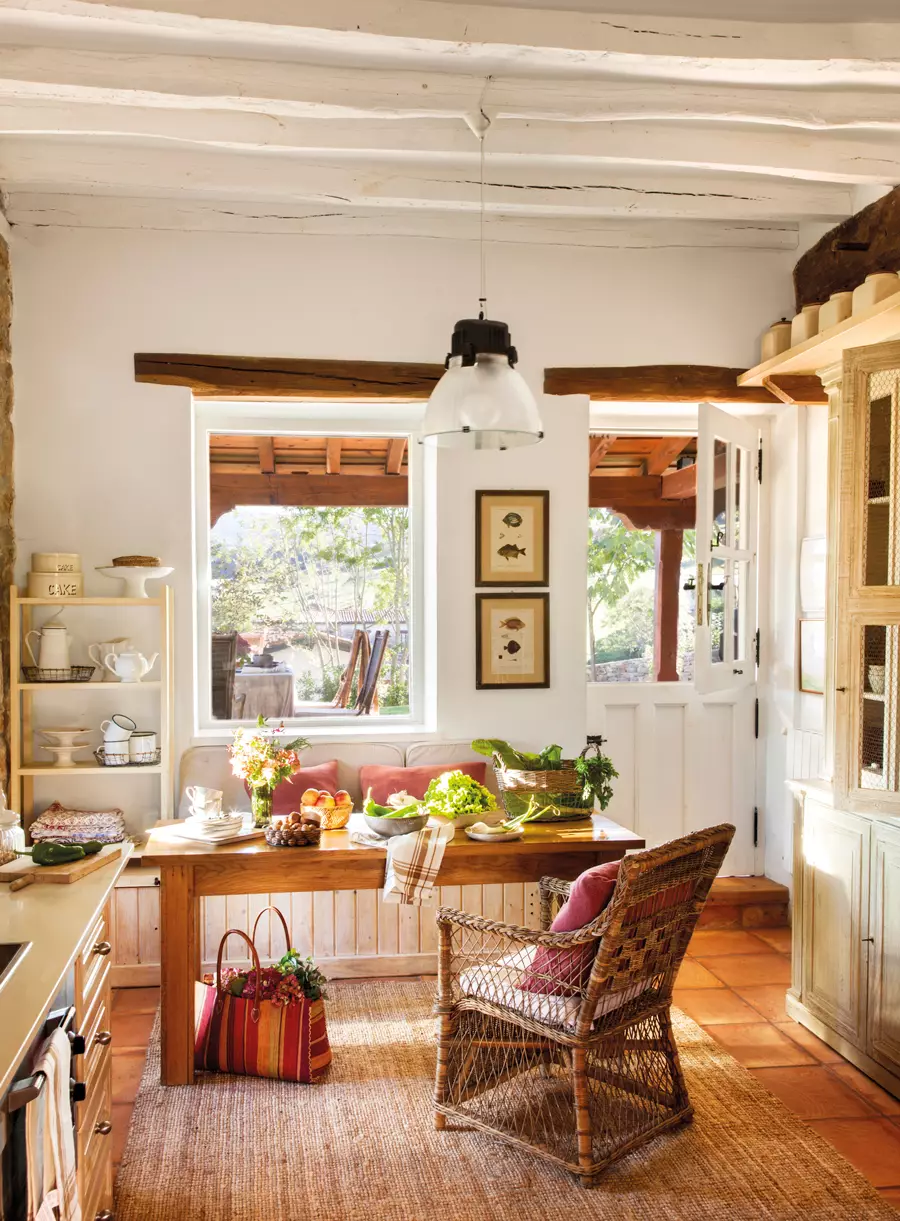 Rustic kitchen with office with wooden table and bench