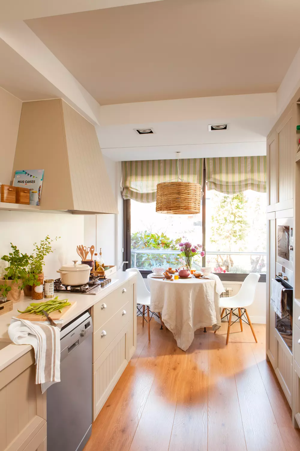 Kitchen with two fronts of furniture and office next to the window