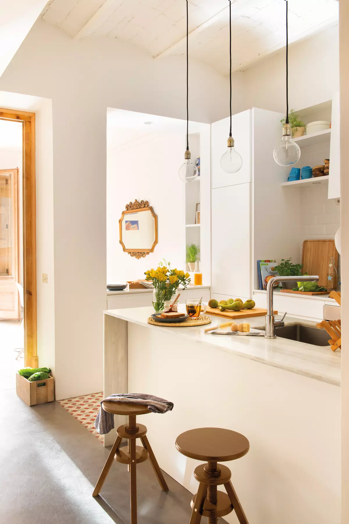 White kitchen with peninsula and bar