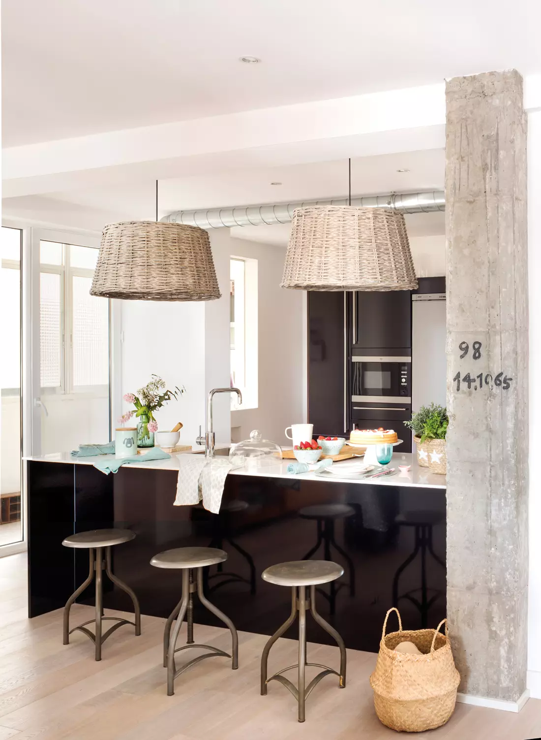 Kitchen with black cabinets and bar on the peninsula