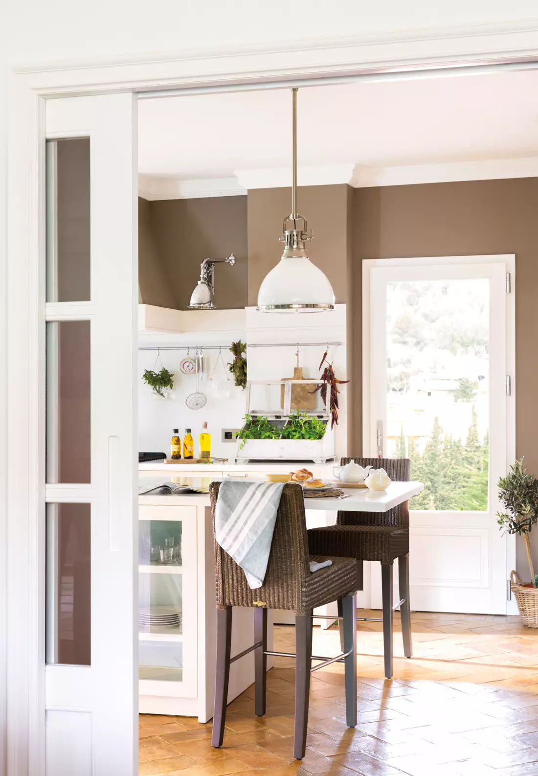 Kitchen with island and flown countertop as a table