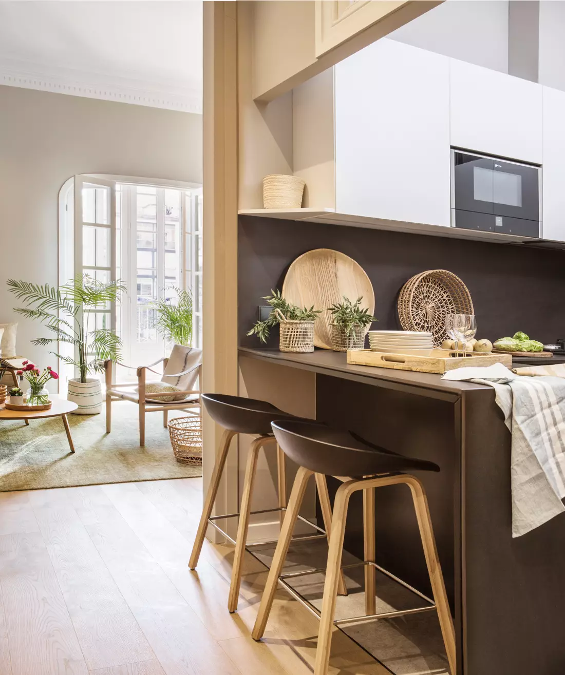 Kitchen with brown furniture and extended worktop as a bar