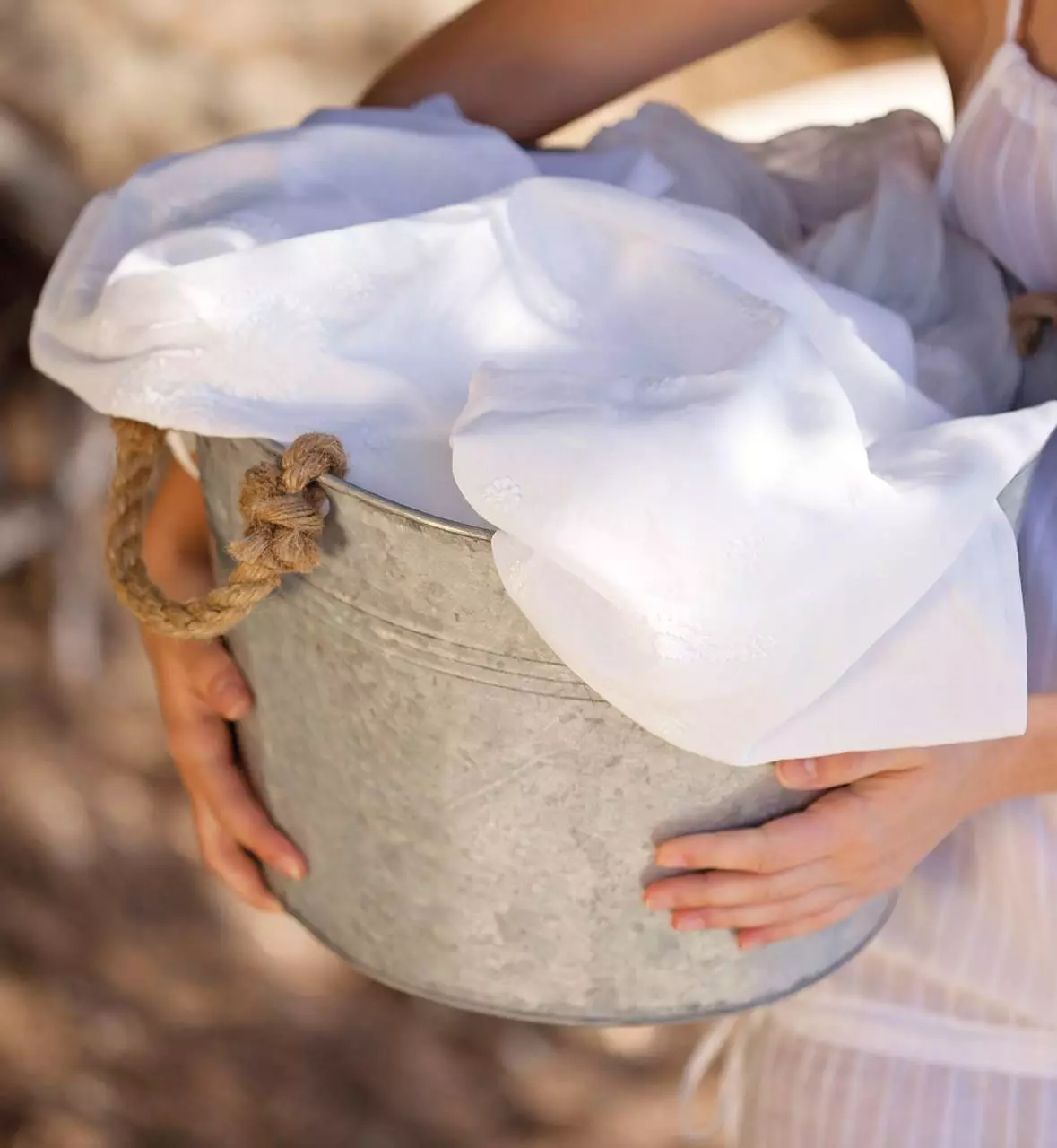 metal basket with white clothes