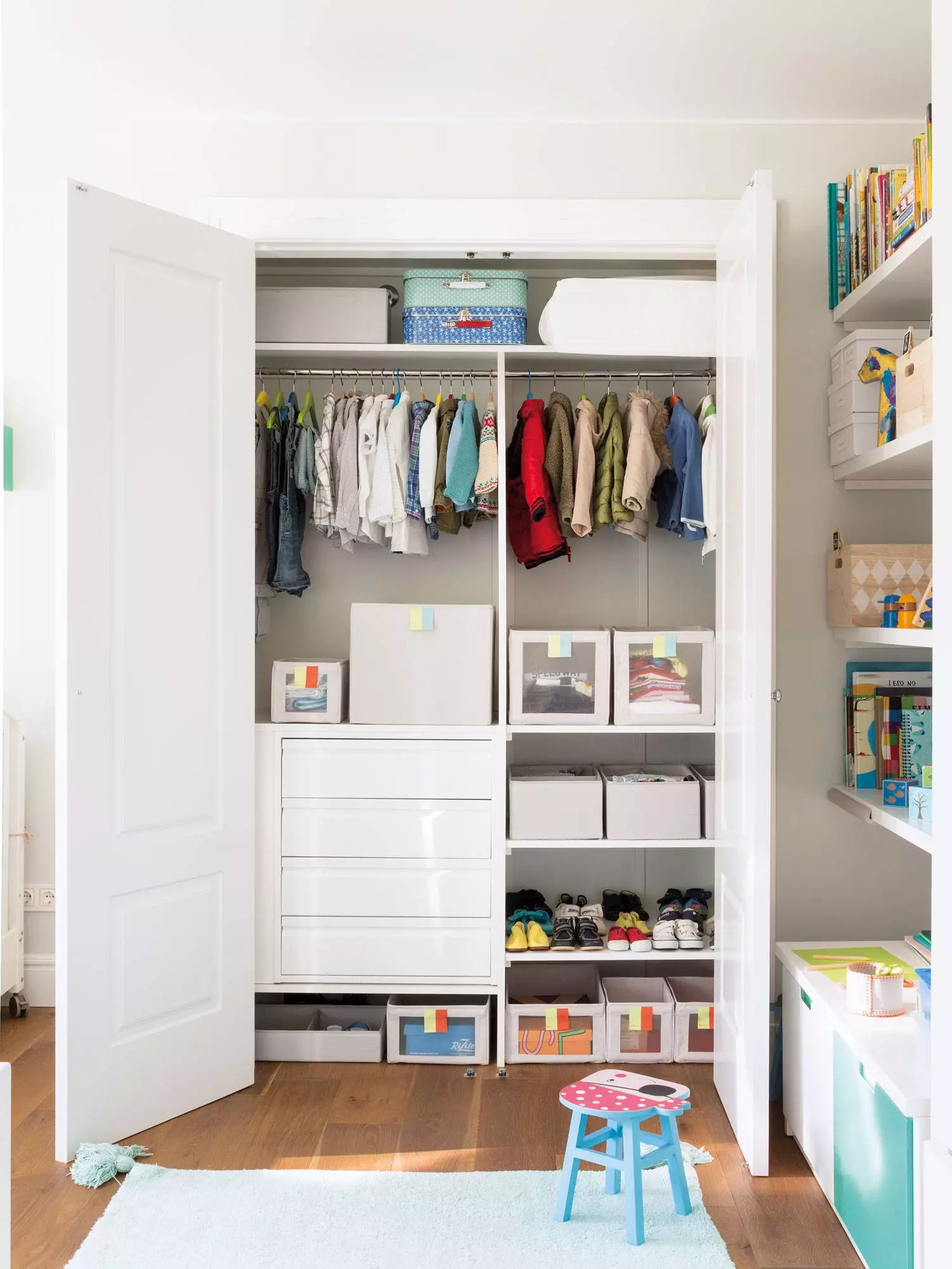 order children's room with closet and organized toys_464832