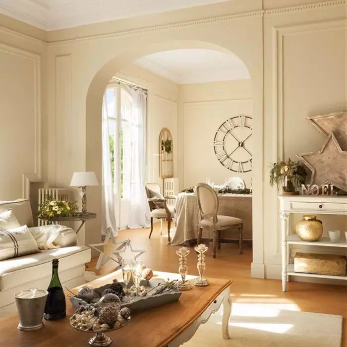 Dining room with arch, medallion chairs, Provençal table, sideboard, clock and molded walls