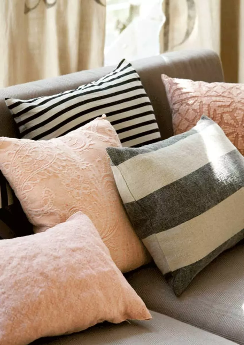 Pink-and-triped-cushions-on-grey-sofa-412214