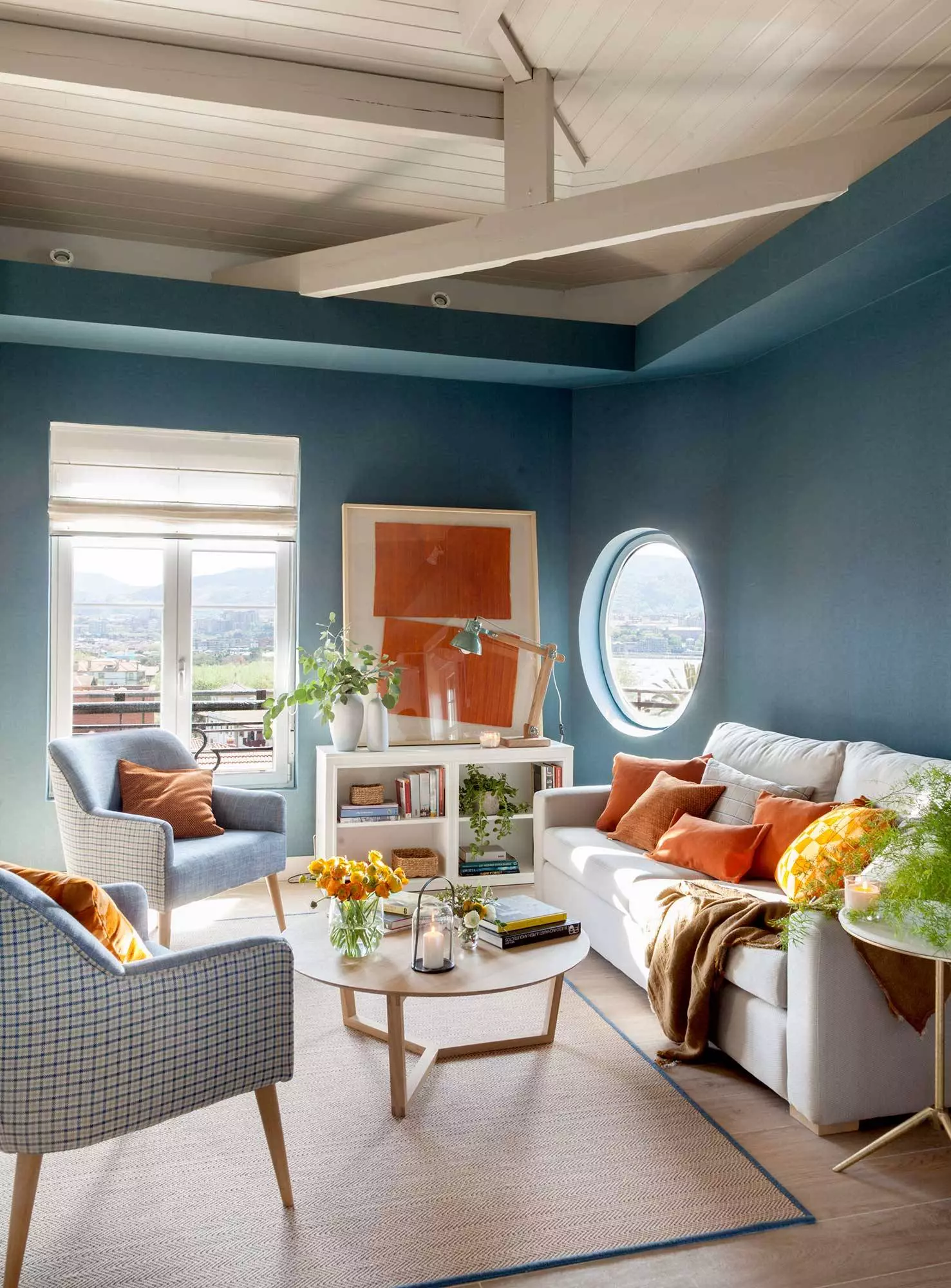 blue painted living room with orange accessories_00511448 O